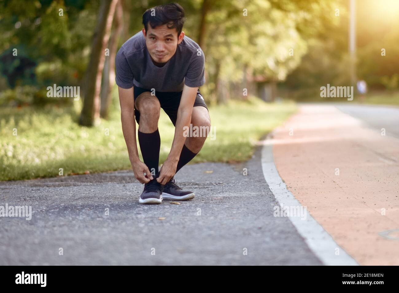 Asian Runner man running in city park morning outdoors Stock Photo - Alamy