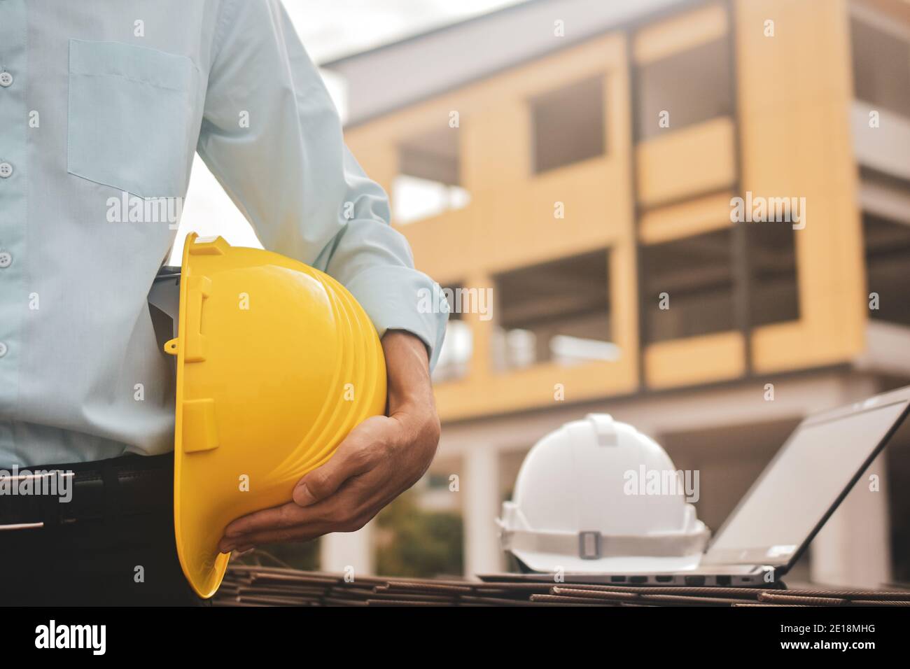 Male Businessman holding helmet building construction background Stock ...
