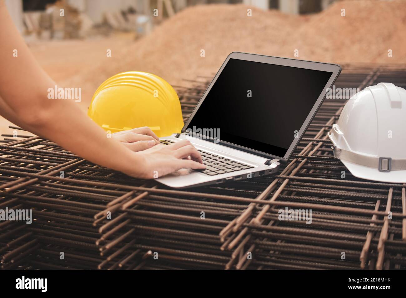 Close-up construction worker using computer helmet on building site ...