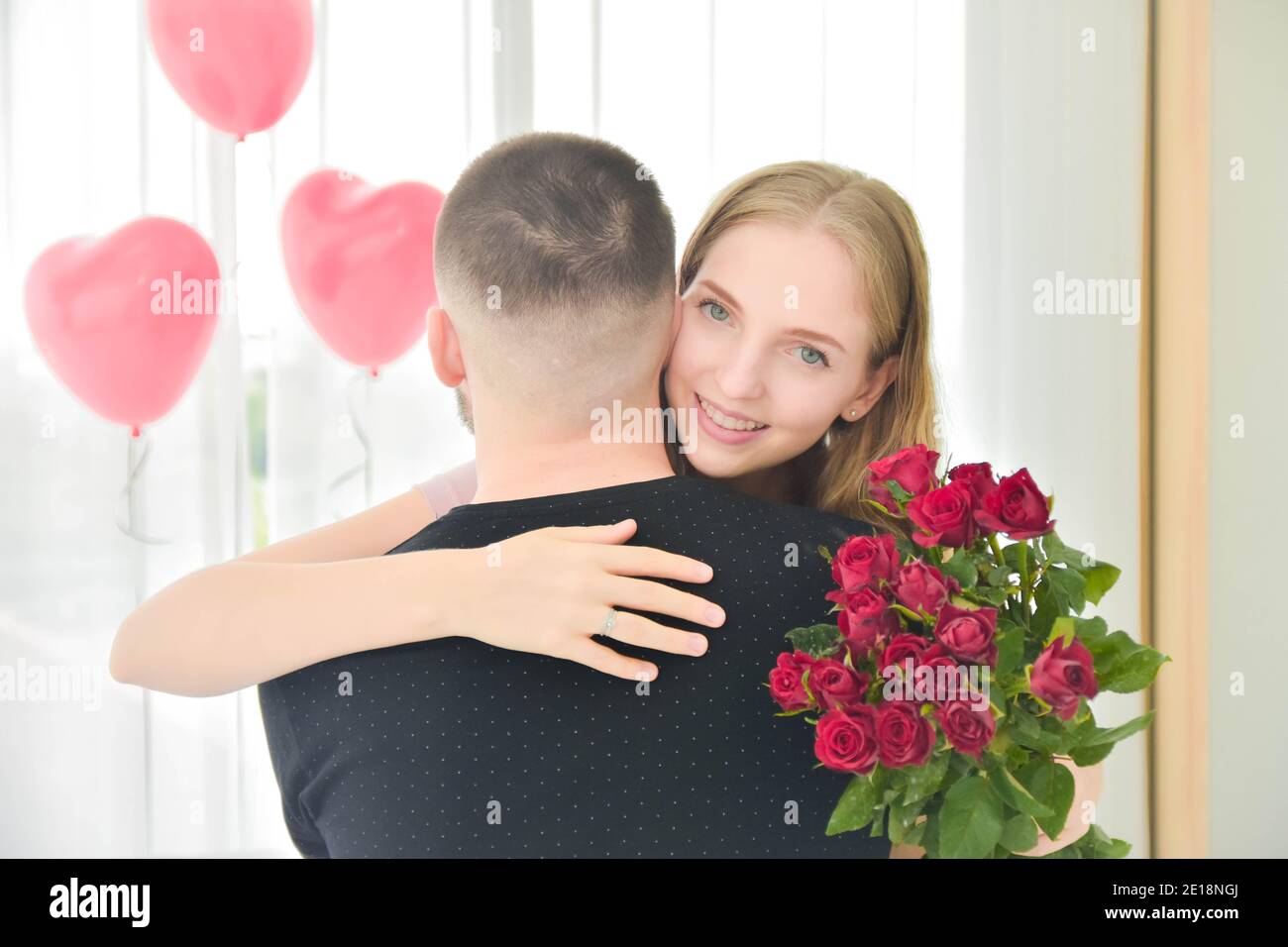 Love Couple giving Rose flower in bedroom happiness in love Valentine's ...