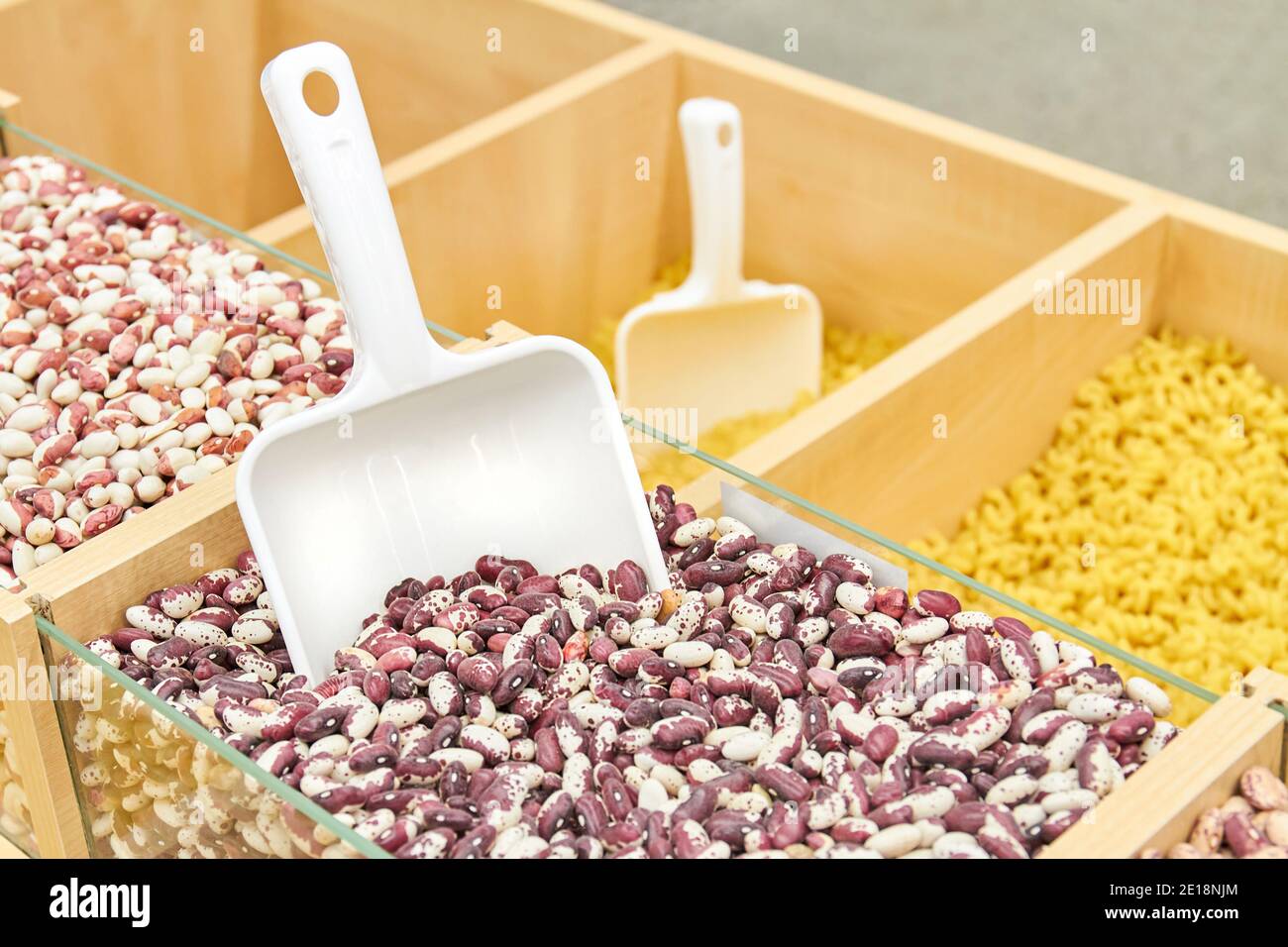 Red beans in a tray with a plastic grain spatula in a supermarket Stock ...