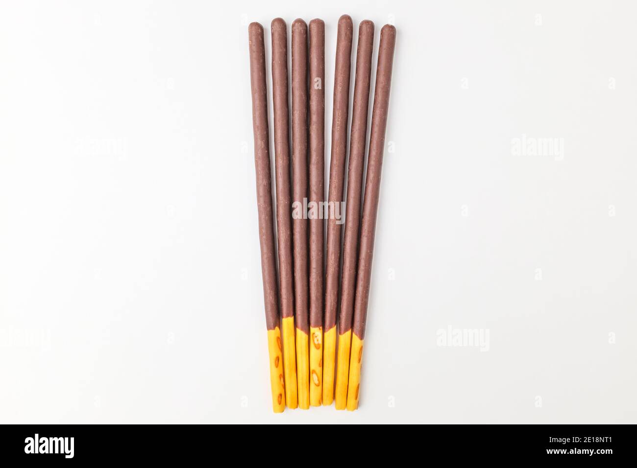Chocolate sticks on white background Stock Photo - Alamy