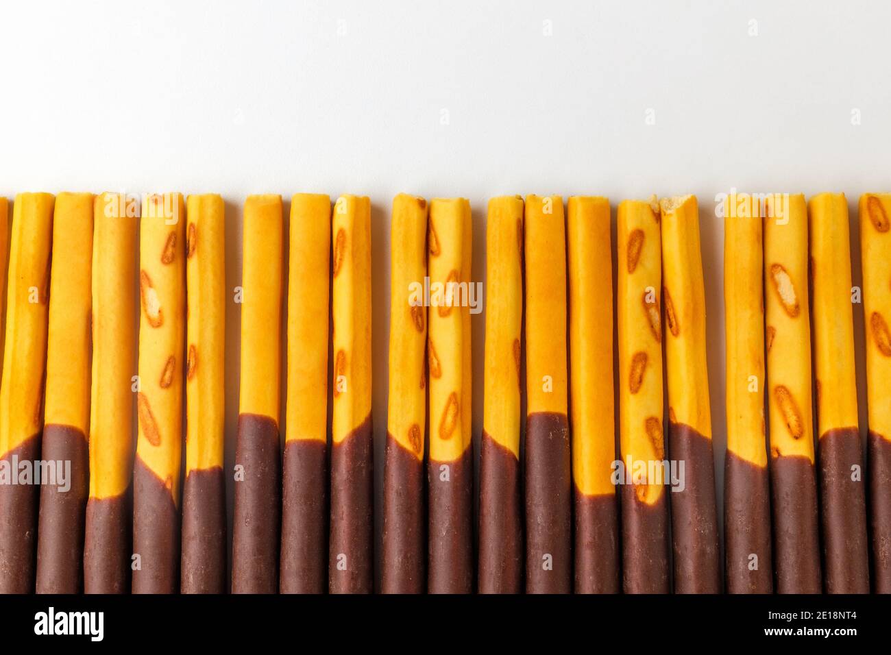 Chocolate sticks on white background Stock Photo - Alamy