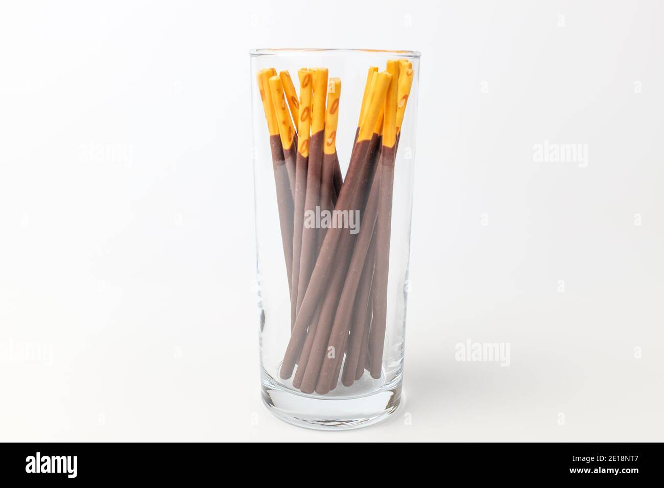 Chocolate sticks on white background Stock Photo - Alamy