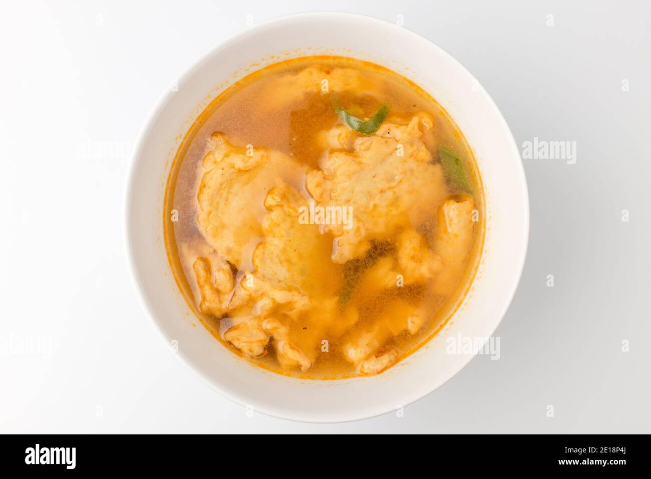 Fish cake soup on a white background Stock Photo - Alamy