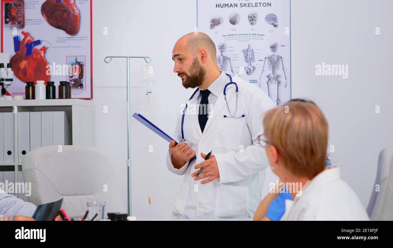 Specialist doctor presenting research informations to the attendees to ...