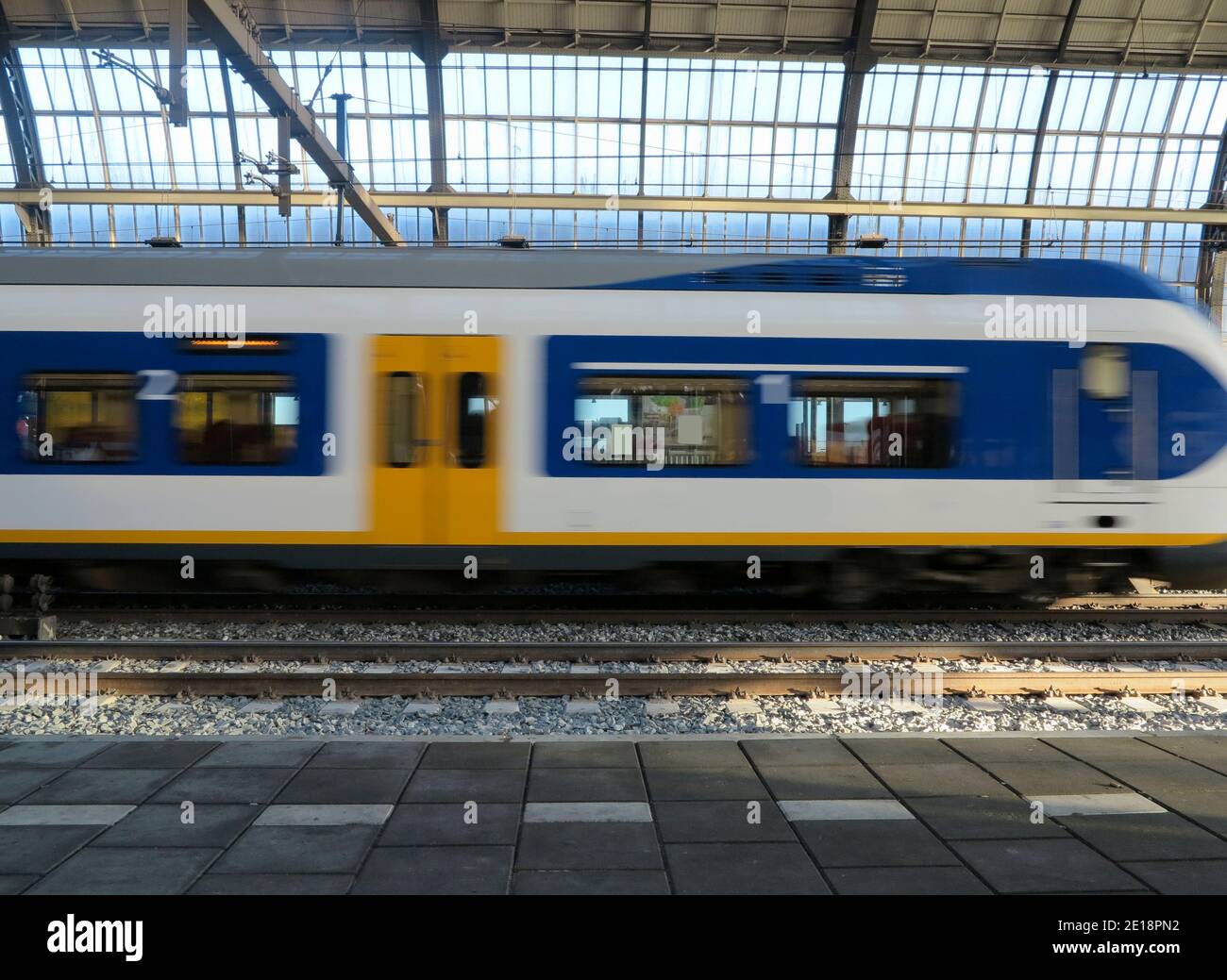 Train arriving at Amsterdam central station Stock Photo - Alamy