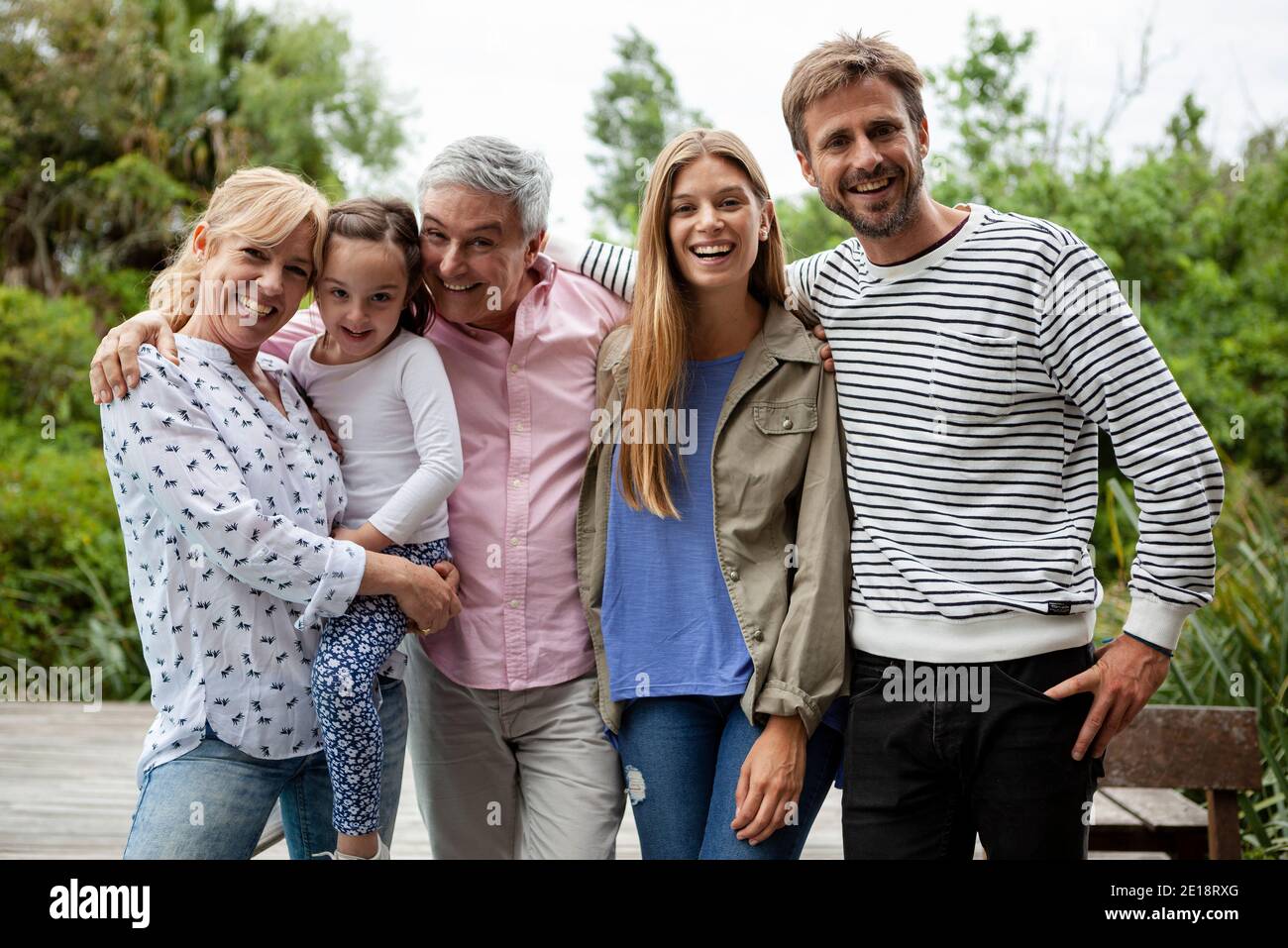 Portrait of happy family standing together Stock Photo - Alamy