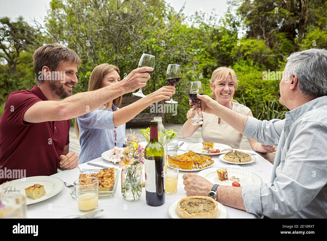 Happy family toasting wine glasses Stock Photo - Alamy
