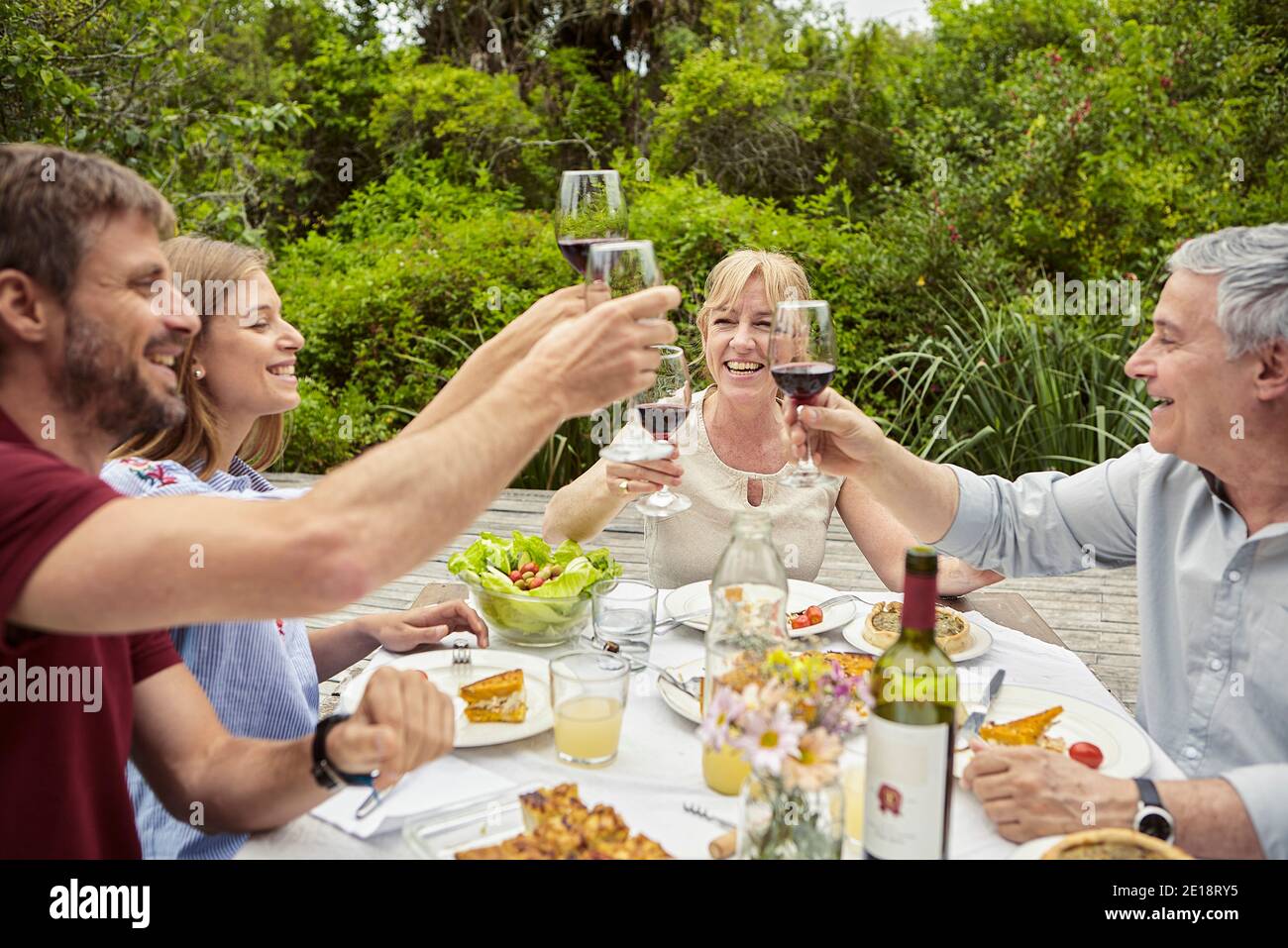 Happy family toasting wine glasses Stock Photo - Alamy