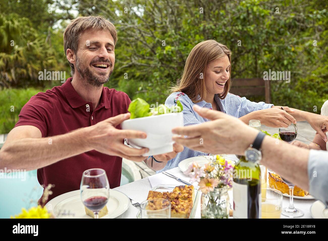 Happy family having meal Stock Photo - Alamy