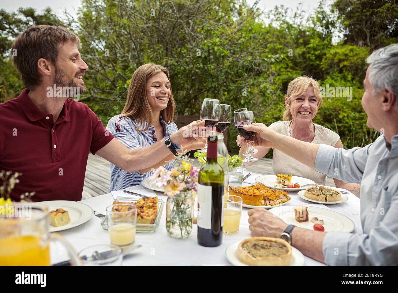 Happy family toasting wine glasses Stock Photo - Alamy