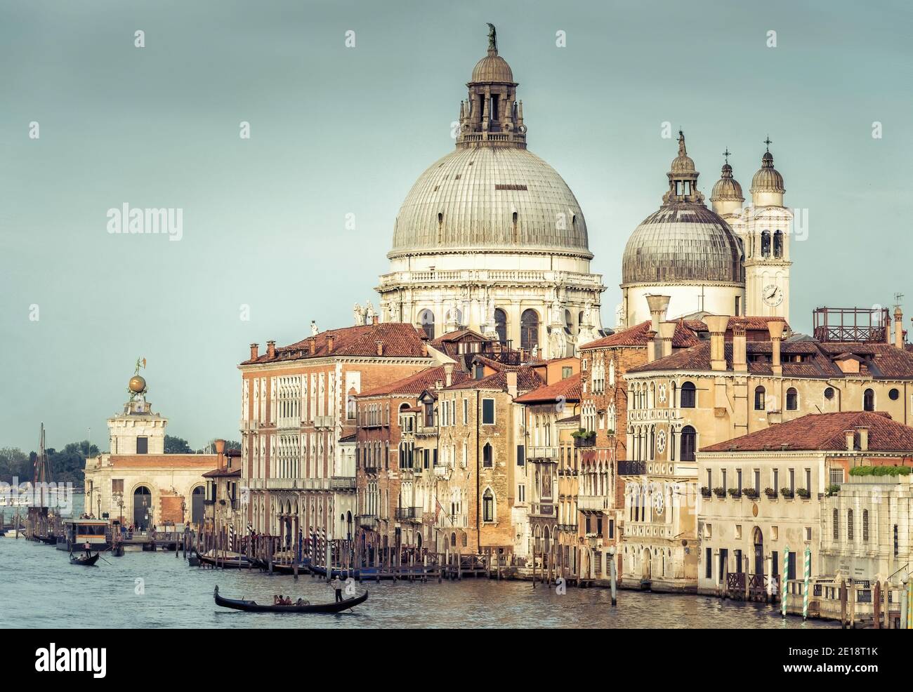 Salute Church, dramatic lighting at sunrise lighting the grand canal ...