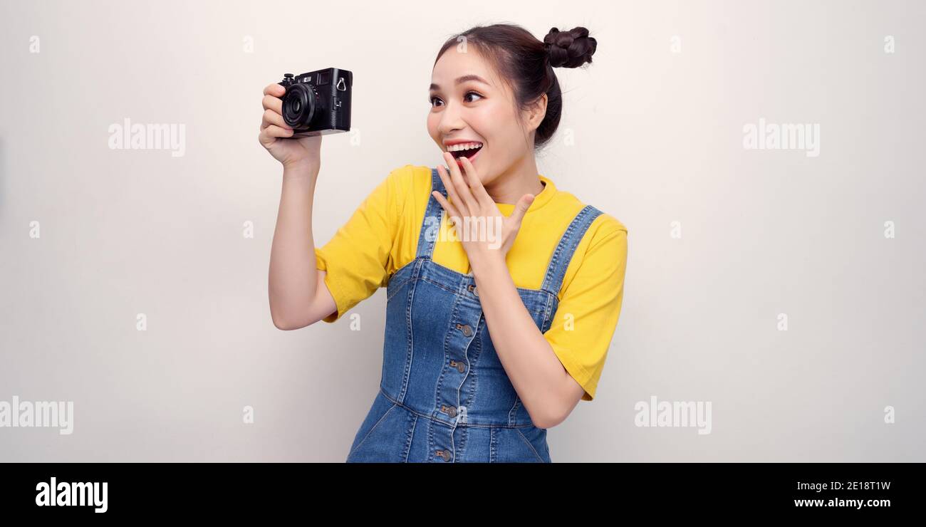 Woman using photo camera in studio Stock Photo - Alamy