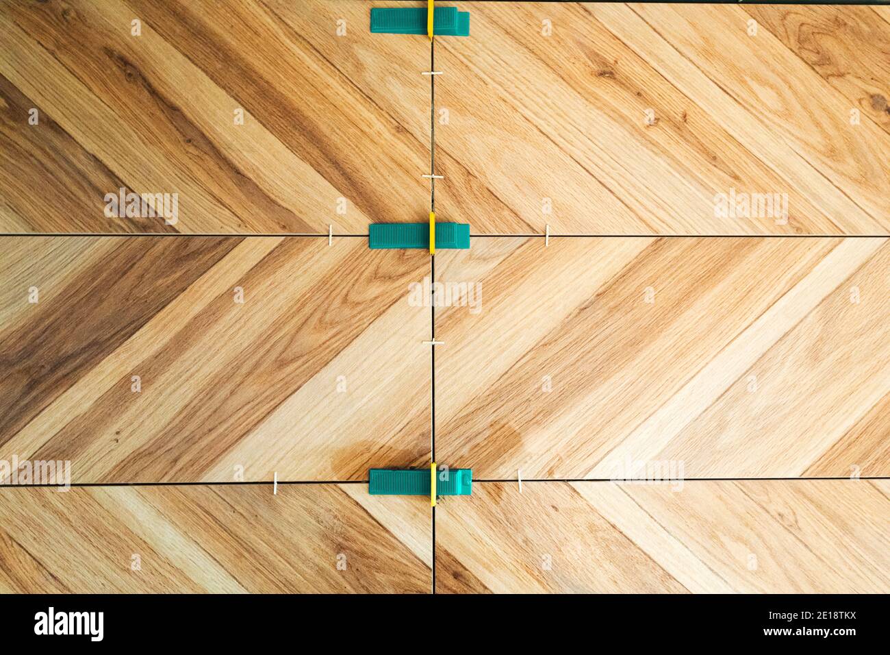 Tiling work. Layed tiles with crosses for tiles and 3d crosses Stock ...