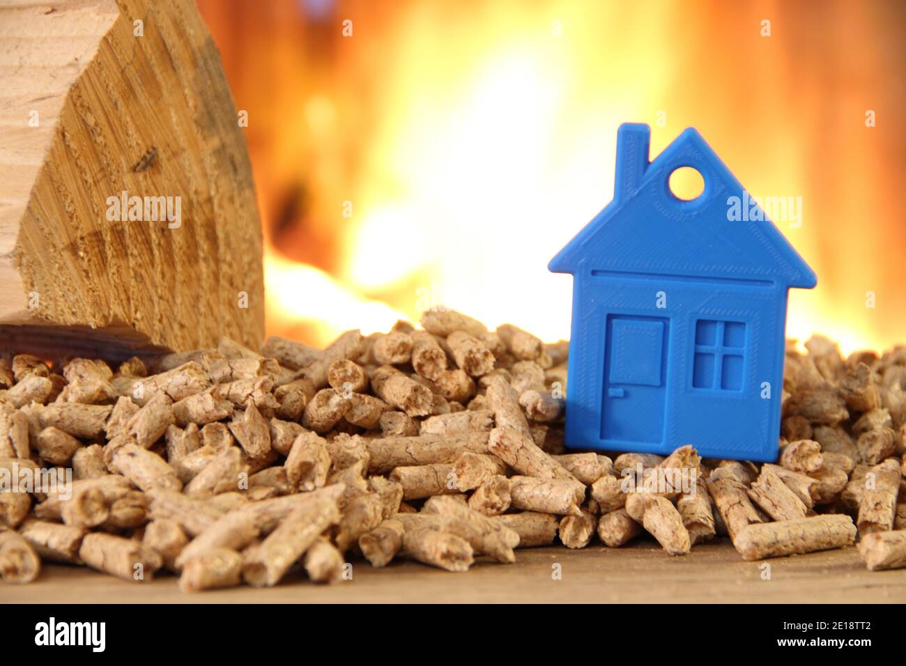 a fireplace with pellets and a small house Stock Photo - Alamy