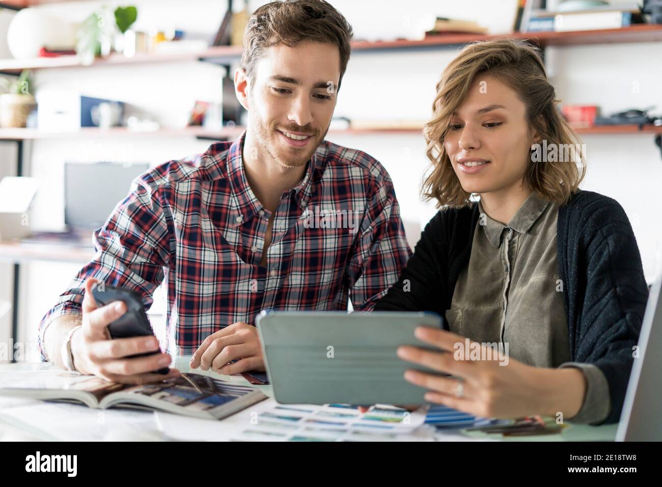 Interior designers using digital tablet and smartphone Stock Photo - Alamy