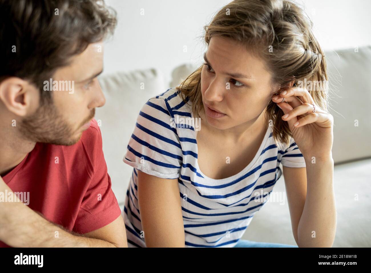 Young couple talking with each other Stock Photo - Alamy