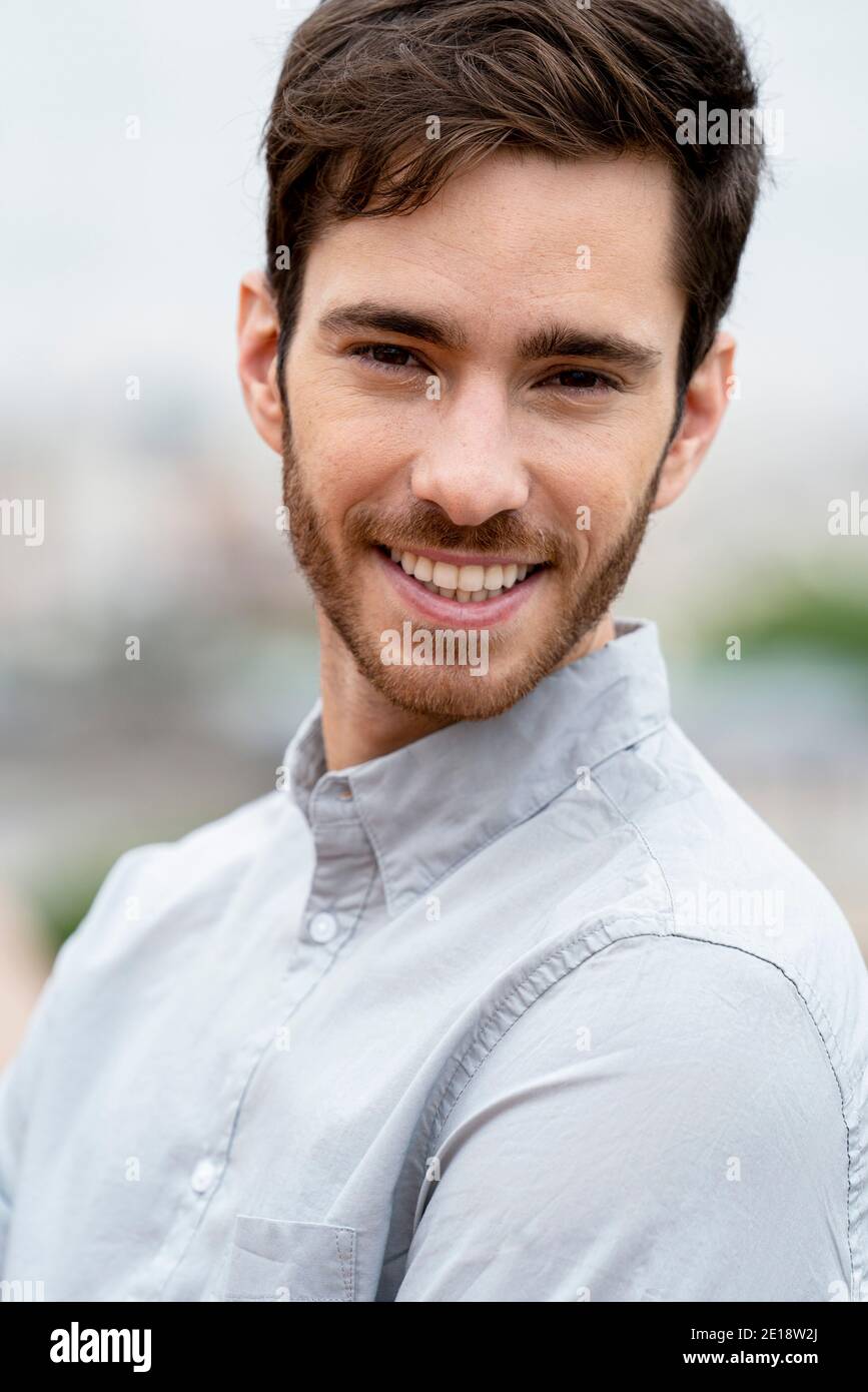 Smiling young man Stock Photo - Alamy