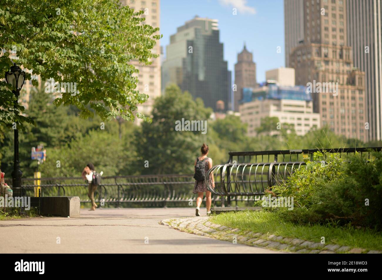 People walk in summer beautiful city park Stock Photo - Alamy