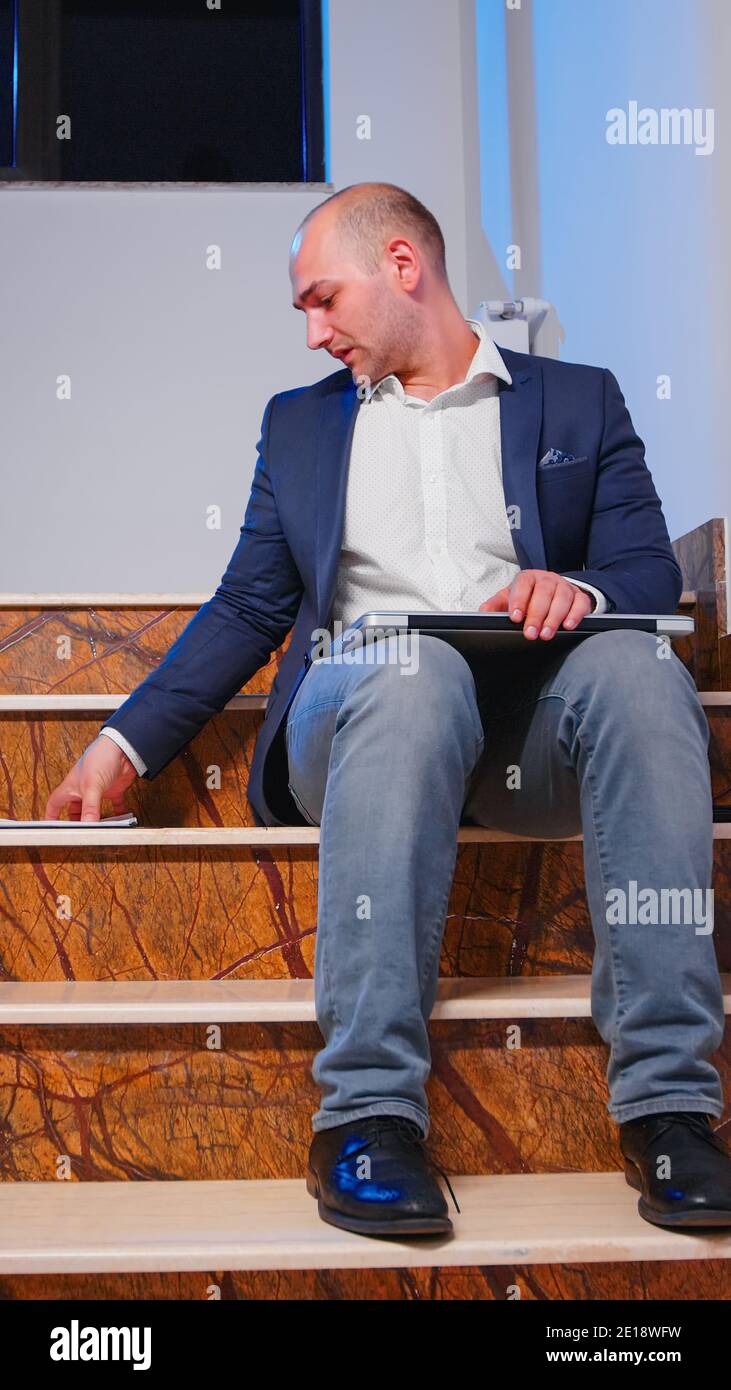 Exhausted office worker closing laptop hi-res stock photography and ...