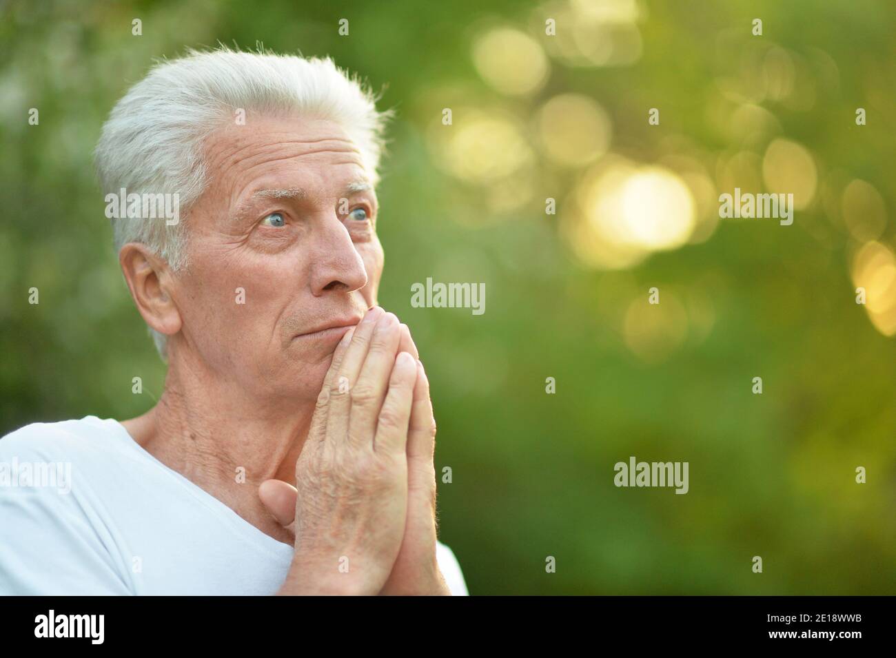 Caucasian elderly male praying hi-res stock photography and images - Alamy