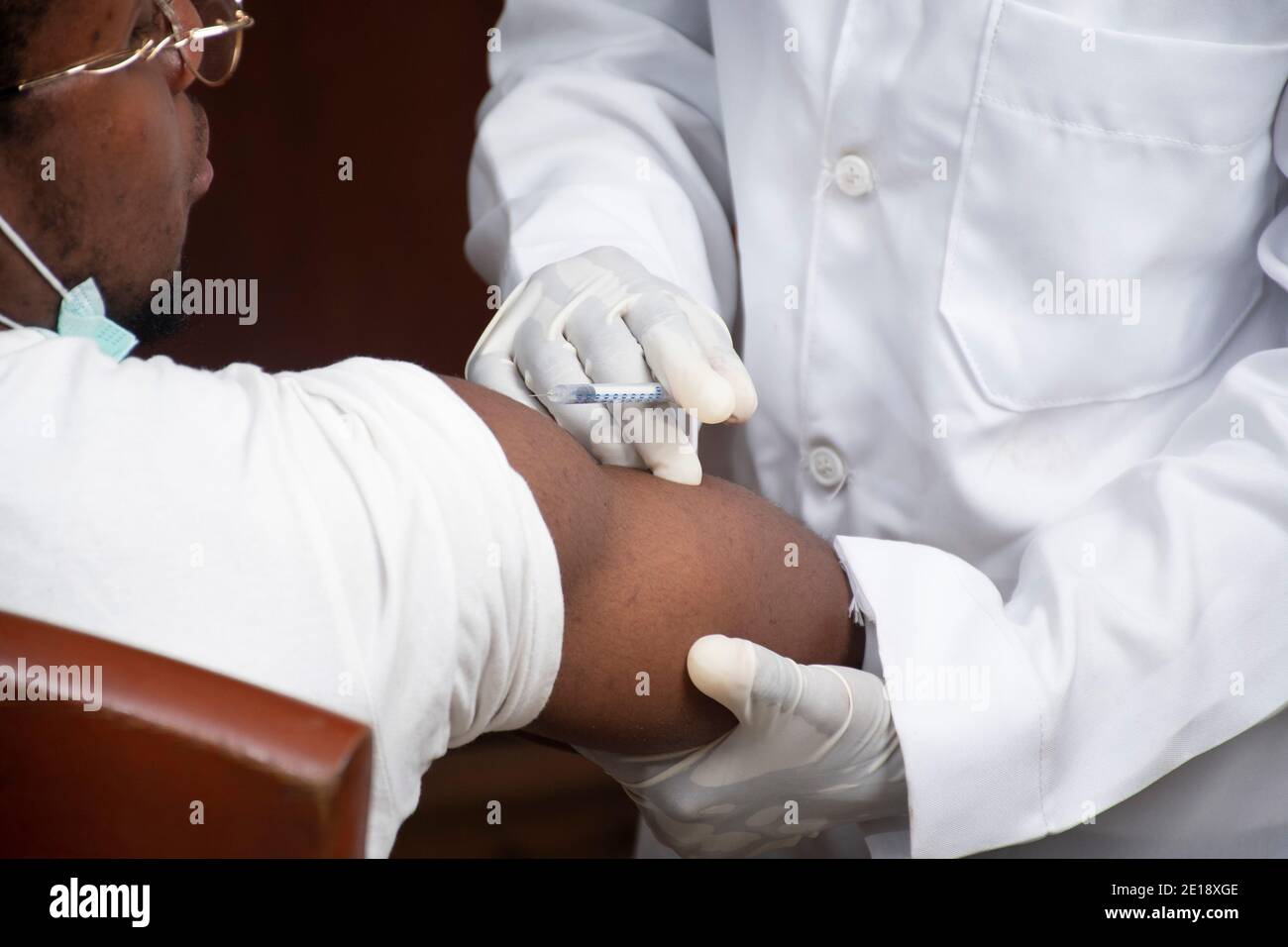 young african man receiving an injection Stock Photo - Alamy