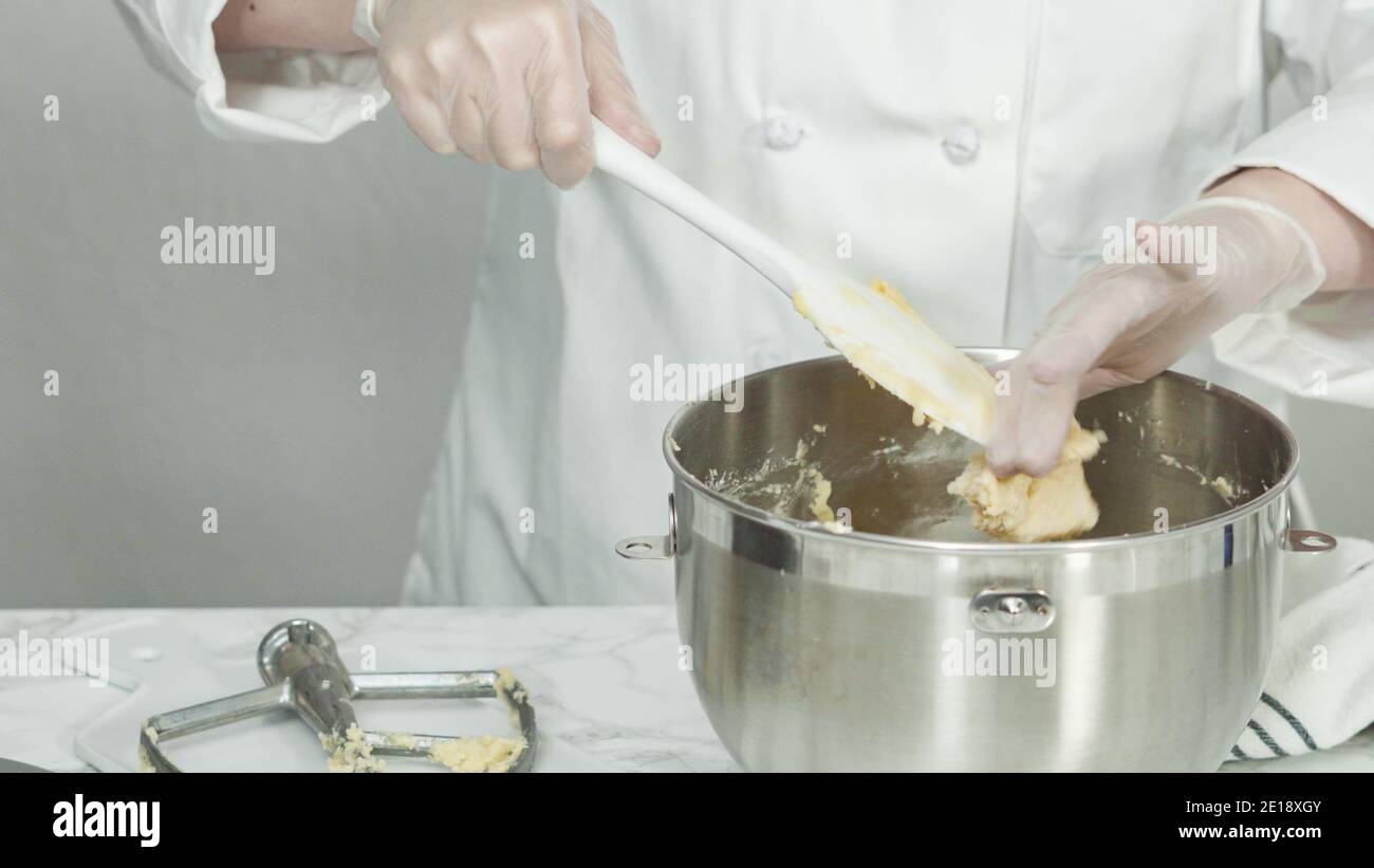 Step by step. Mixing ingredients in standing kitchen mixer to bake ...