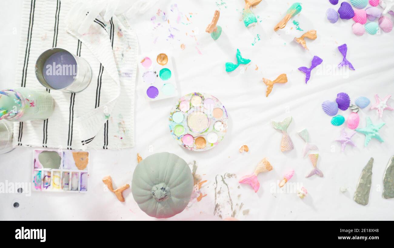 Flat lay. Step by step. Painting mermaid tails and seashells with ...
