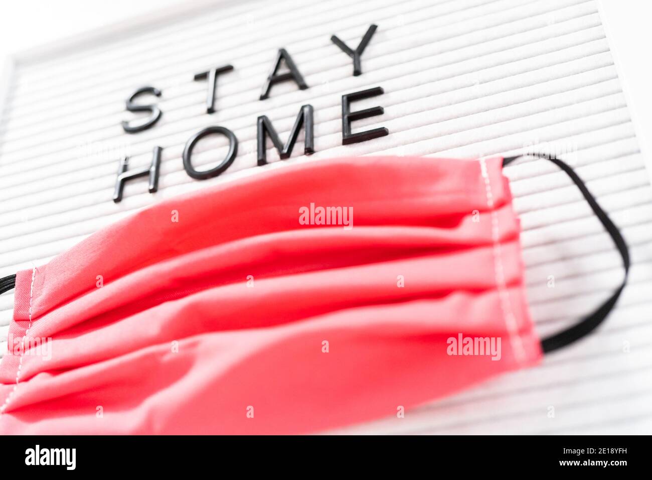 STAY HOME sign on message board with a homemade face mask Stock Photo ...