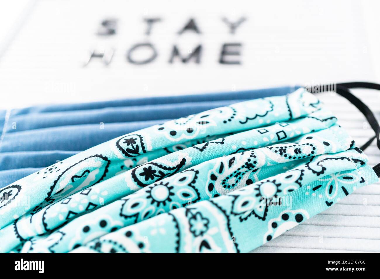 STAY HOME sign on message board with a homemade face mask Stock Photo ...