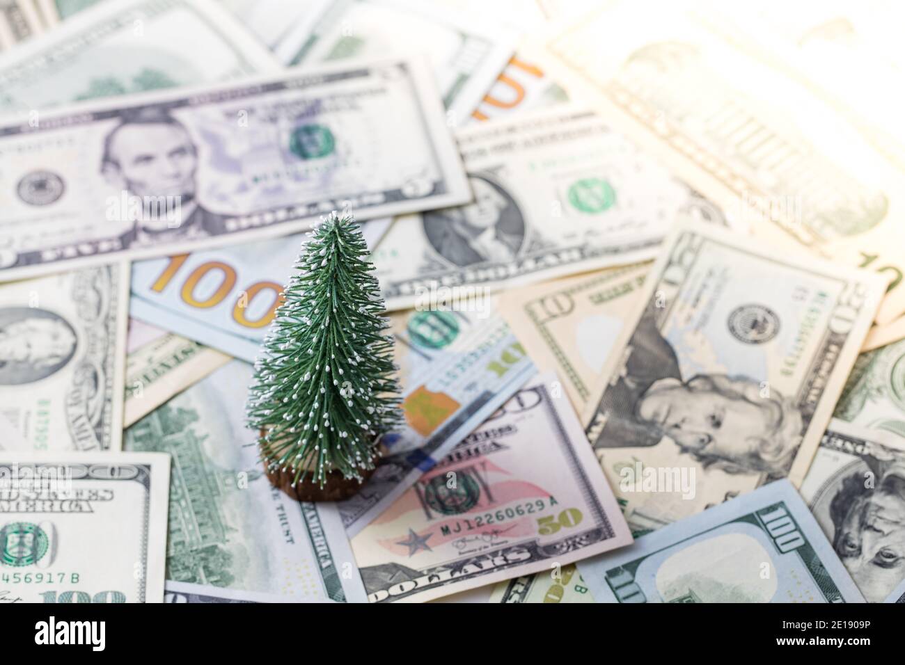 miniature christmas tree on dollar banknotes background for design ...