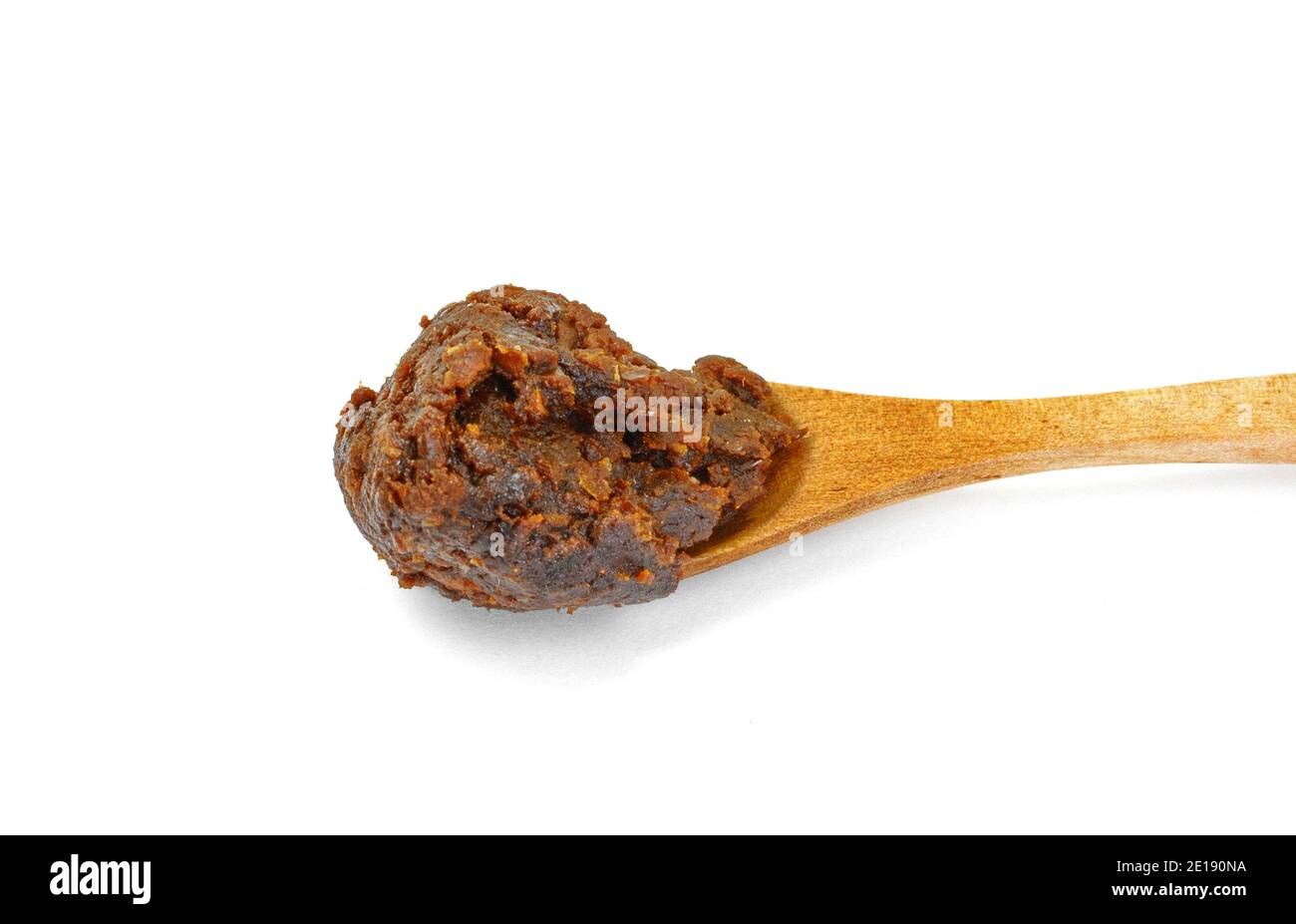 Miso paste in a wooden spoon isolated on white Stock Photo - Alamy