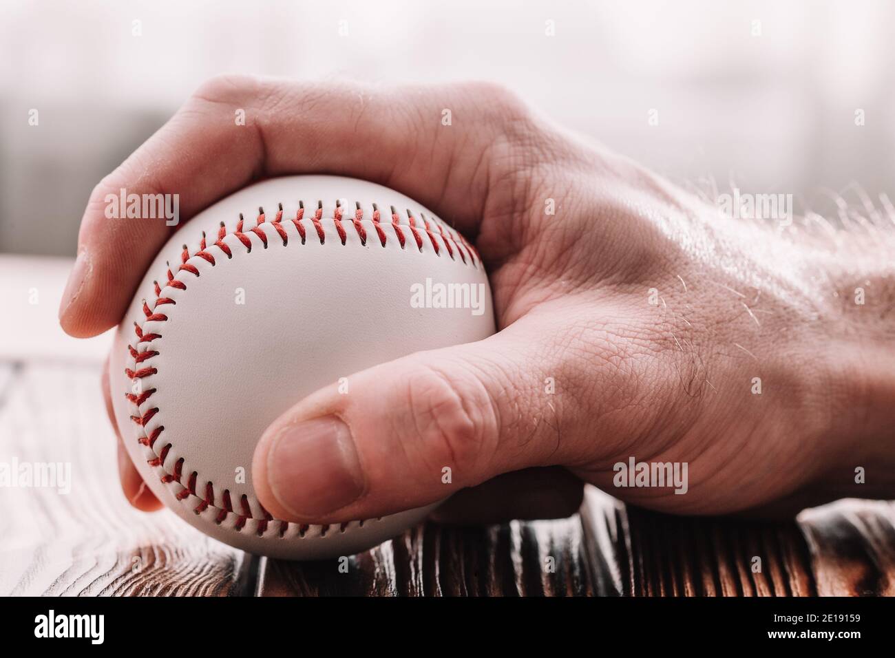 Male hand grabbing a baseball - pitcher technique in play Stock Photo ...