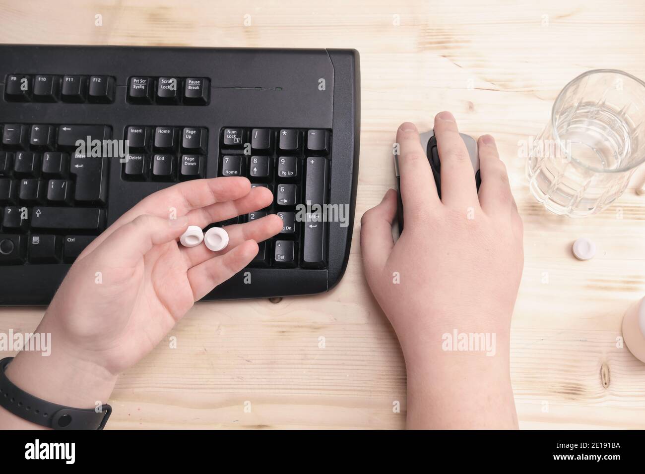e-sport supplements. hand holding chewing gum and capsules for ... e-sport supplements. hand holding chewing gum and capsules for ...