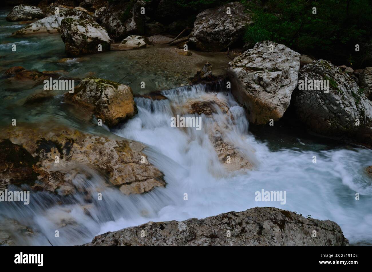 wild water flow between rocks in the mountains Stock Photo - Alamy