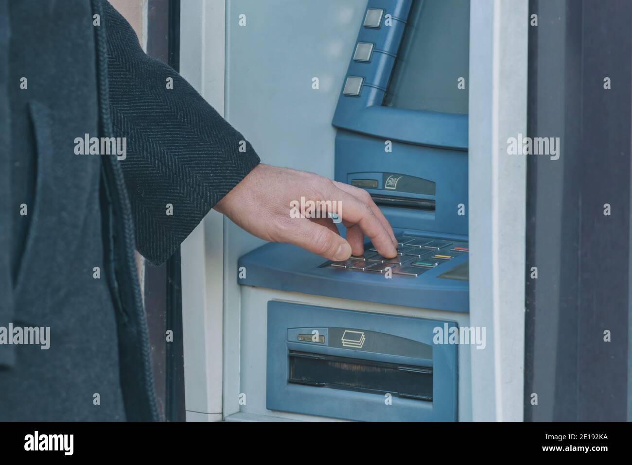 Male using atm machine hi-res stock photography and images - Alamy
