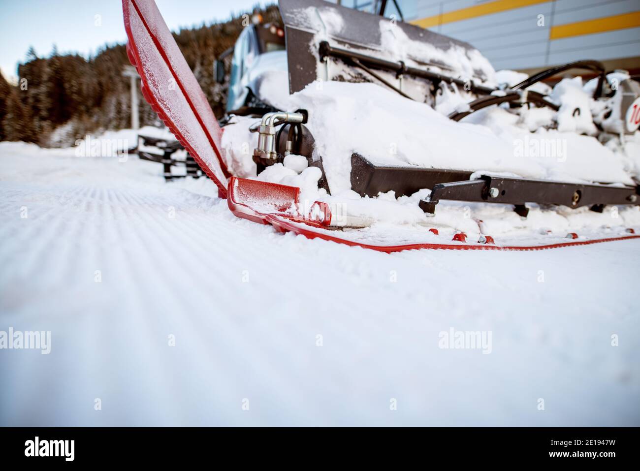 Close up view of special snow vehicle with the caterpillar on the snow ...