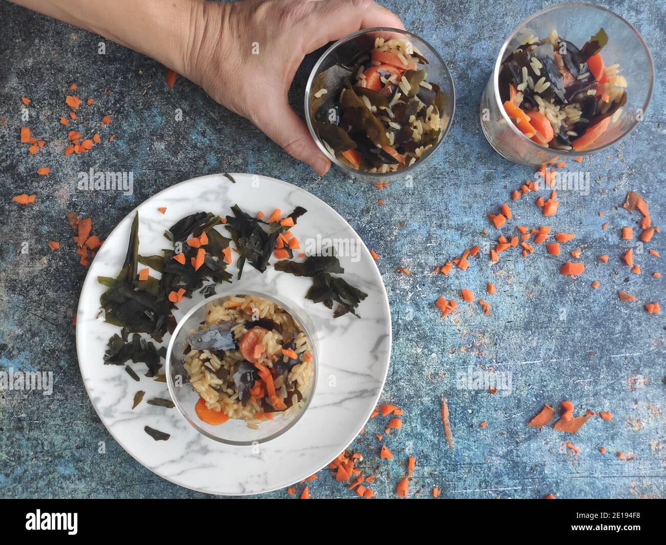 Seaweed and carrots rice in a blue background Stock Photo - Alamy