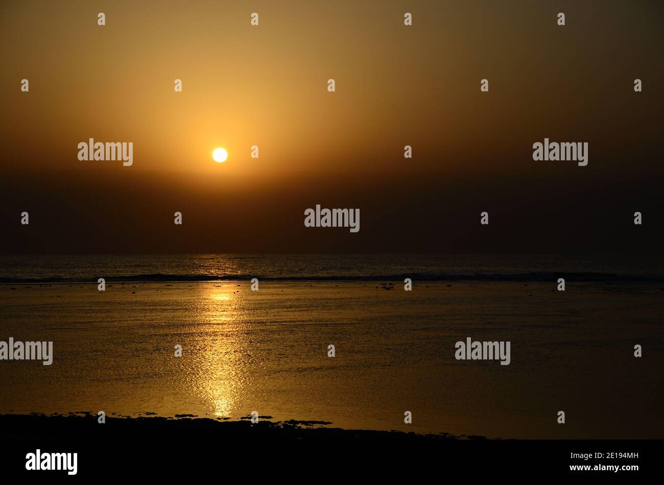 warm sunrise on vacation at the beach and sea Stock Photo - Alamy