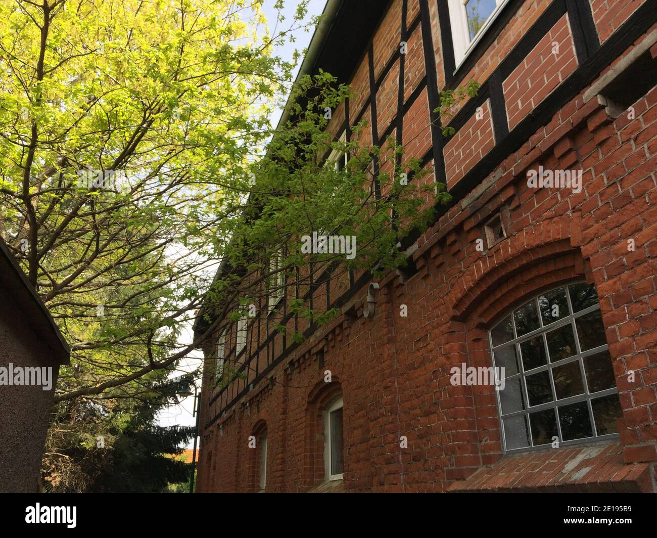 beautiful historical and ancient red brick truss barn in spring Stock ...