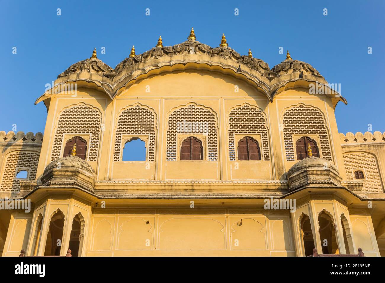 Facade of a historic yellow building in downtown Jaipur, India Stock ...