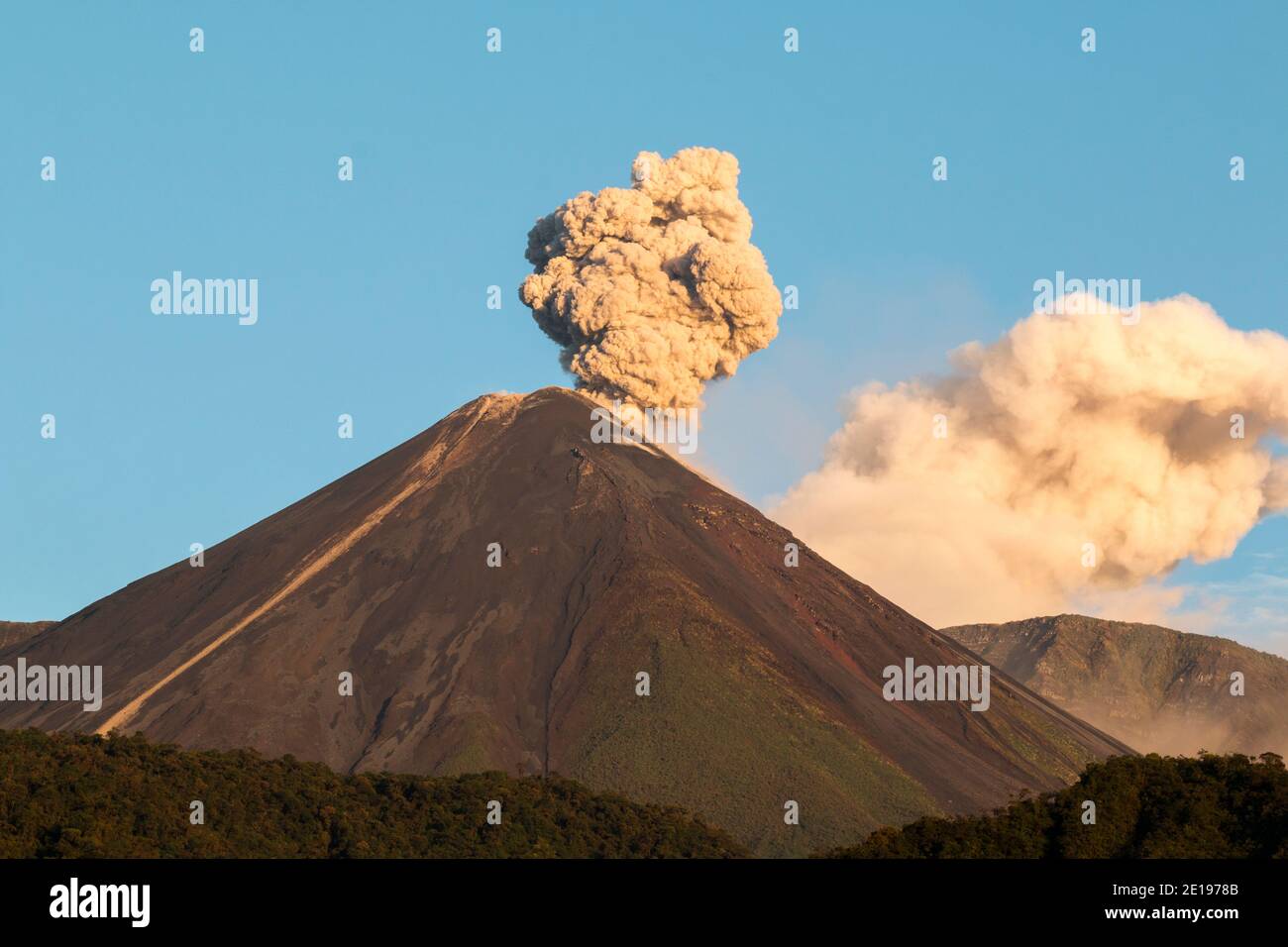Reventador Volcano erupting at dawn, August 2016. The mountain is ...