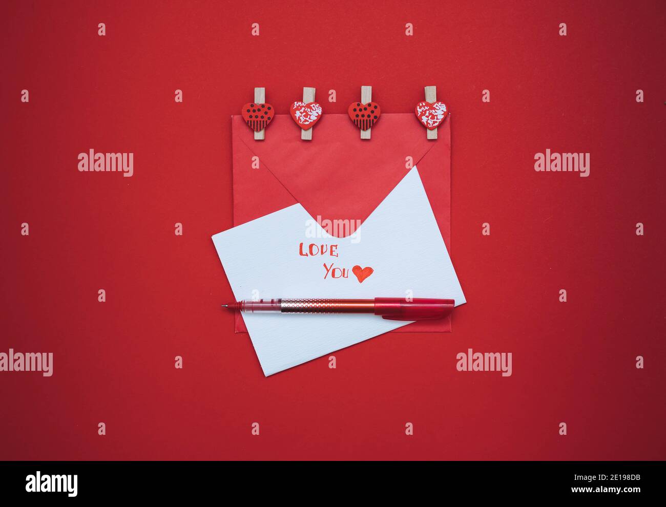 Red Valentine's day background. Handwritten note I LOVE YOU and red ...