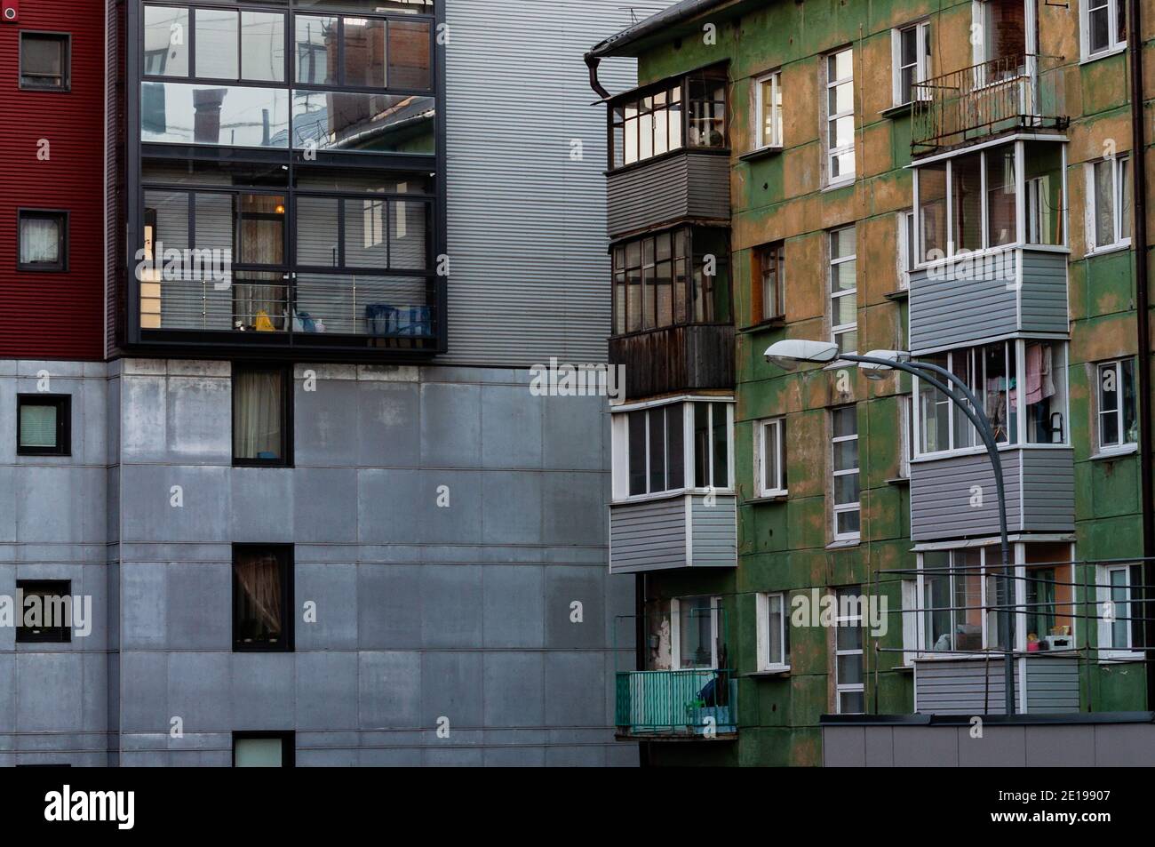 modern and old building standing next to each other Stock Photo - Alamy