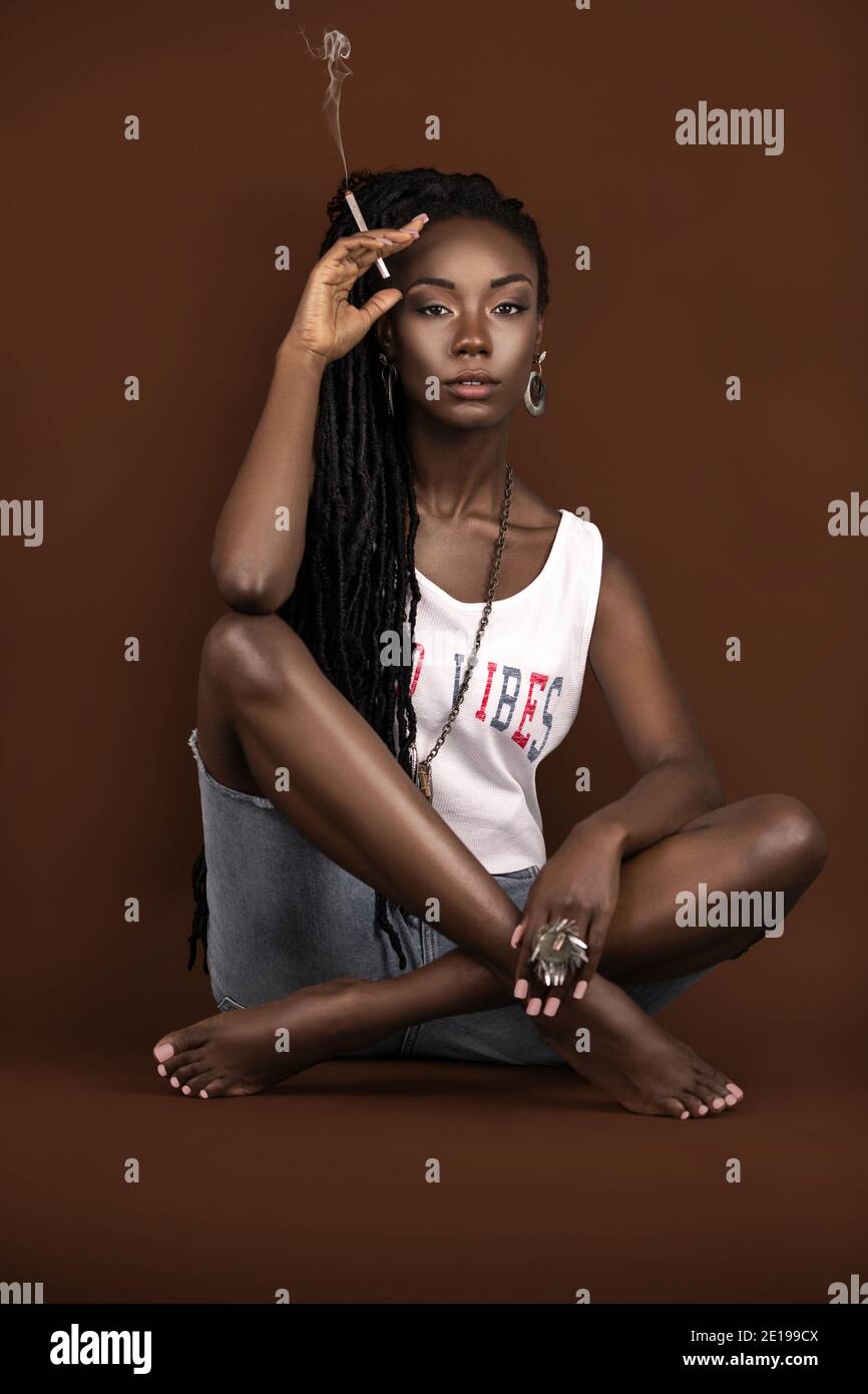 Portrait of a beautiful black female with long dreadlocks, beautiful ...