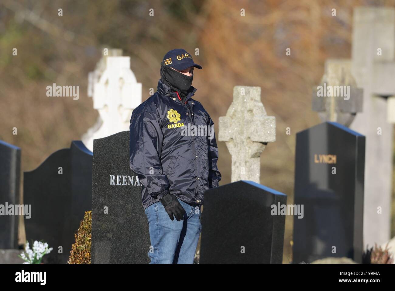 Garda officers observe the funeral of former Real IRA leader Michael ...
