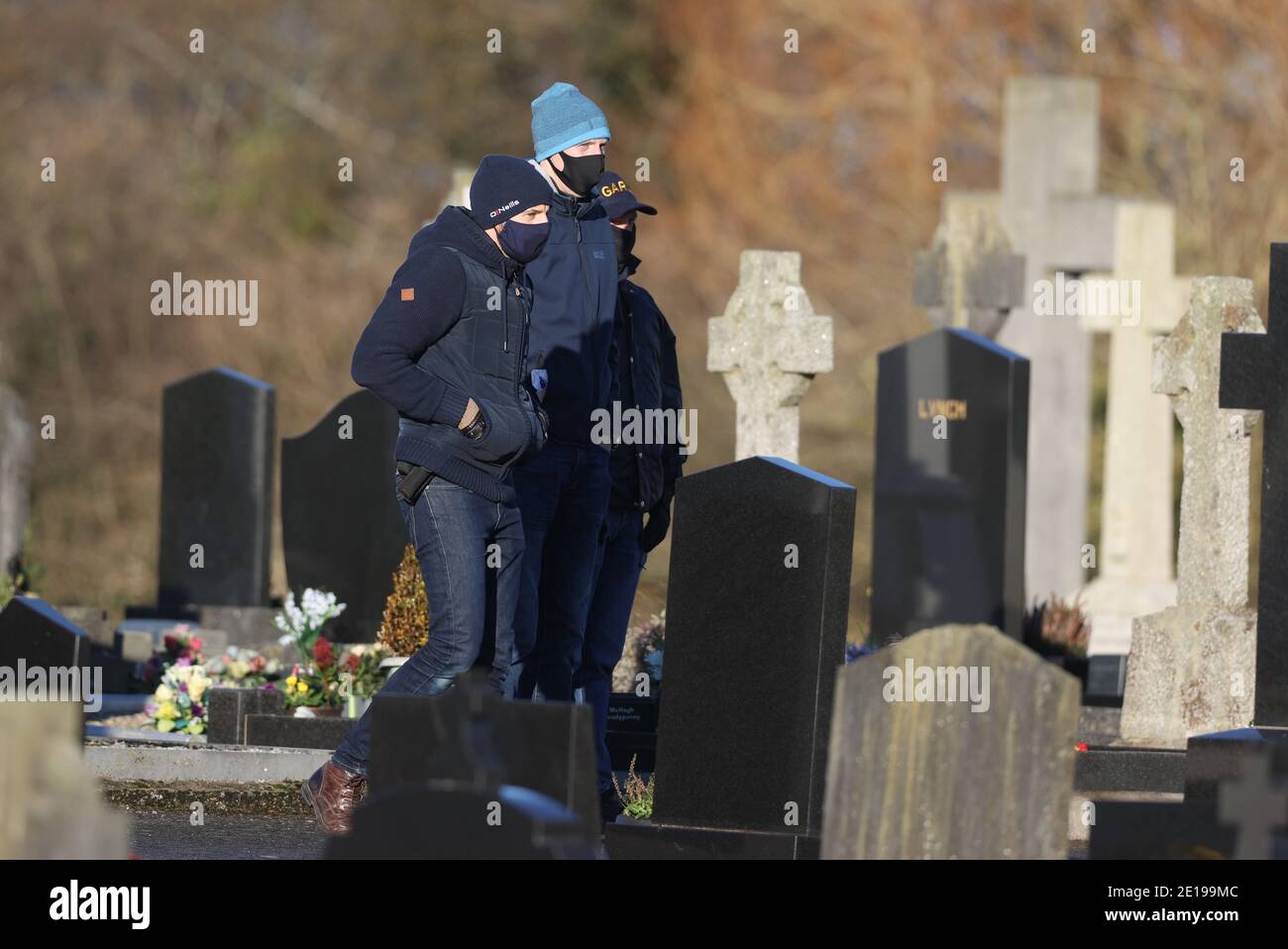 Garda officers observe the funeral of former Real IRA leader Michael ...