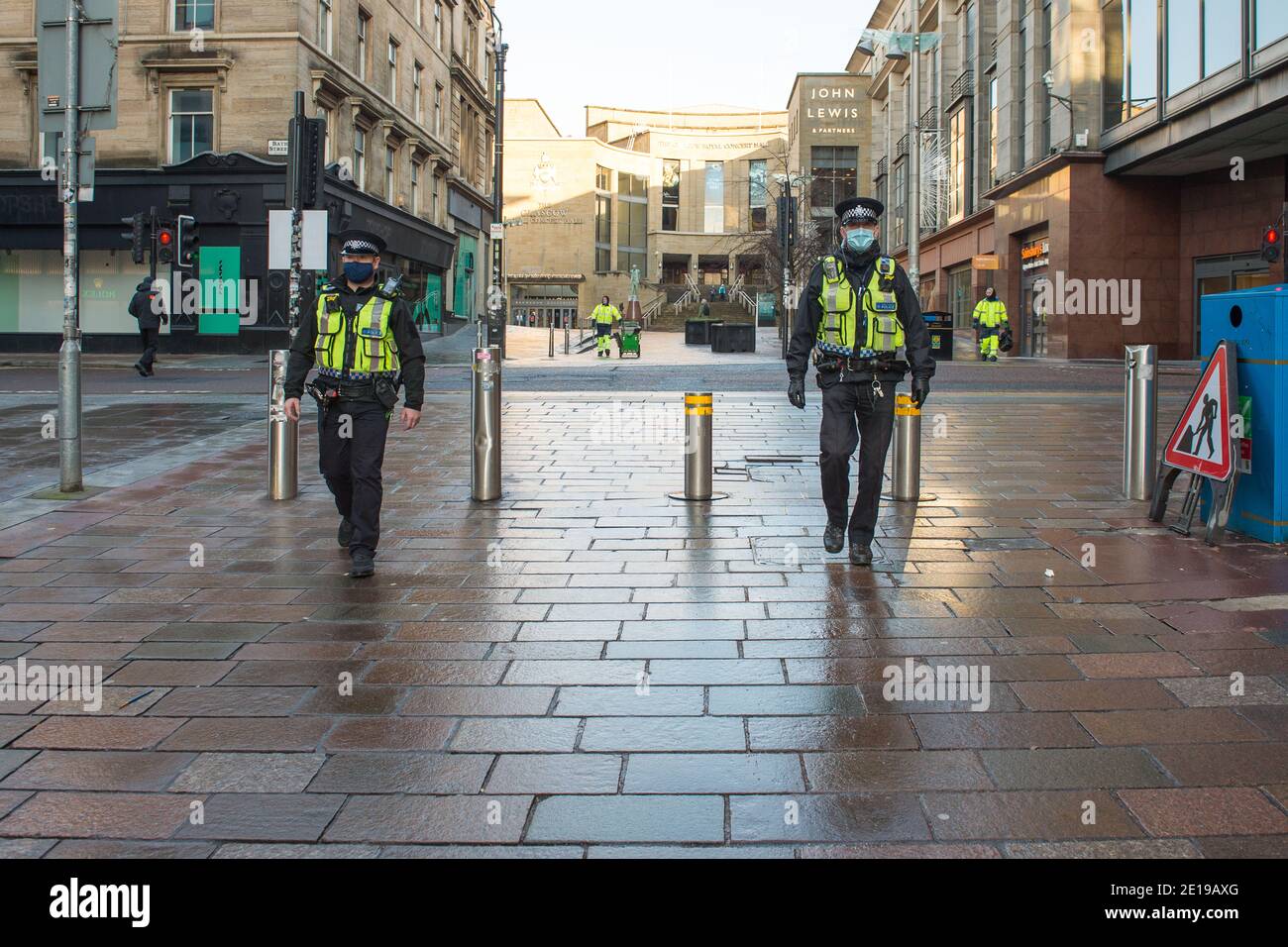 Uk police officers high viz walking in empty street hi-res stock ...