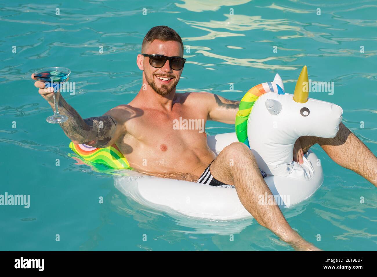 Bearded tattooed man resort hi-res stock photography and images - Alamy